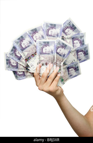 Hand holding british pounds isolated over white background, england ...