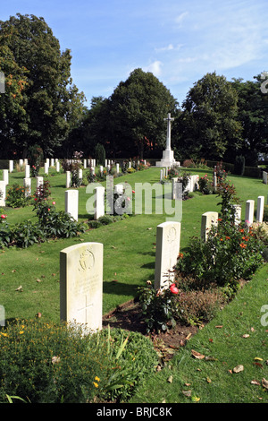 WWI Ramparts Cemetery / Lille Gate with Cross of Sacrifice and graves ...