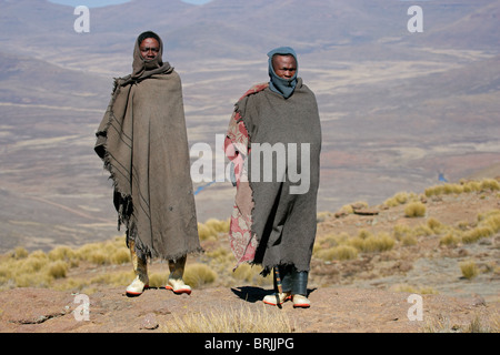 A Basotho shepherd in the traditional blanket up in the highlands of ...