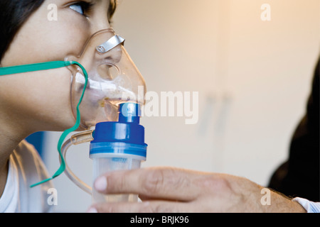 Boy receiving oxygen treatment Stock Photo - Alamy