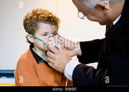 Boy receiving oxygen treatment Stock Photo - Alamy