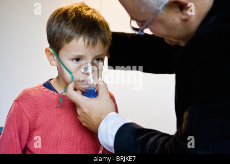 Boy receiving oxygen treatment Stock Photo - Alamy
