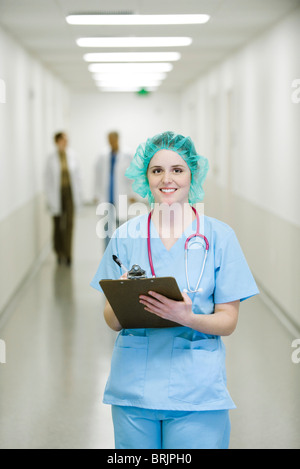Young caucasian nurse woman wearing surgeon uniform over isolated ...