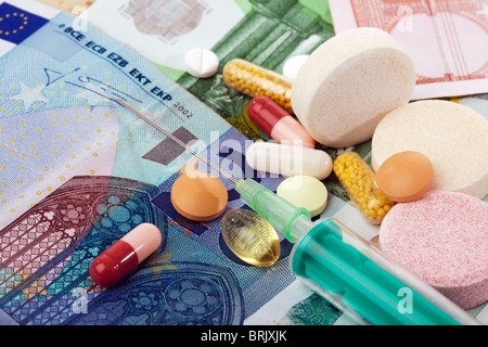 A closeup of pills and syringe with needle Stock Photo - Alamy