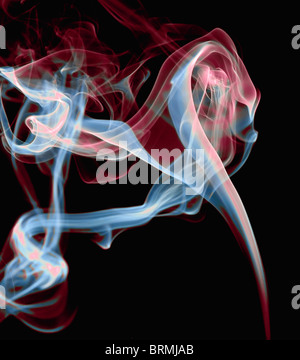 Colorful purple and blue smoke on a black isolated background ...