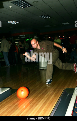 Man ten pin bowling Stock Photo - Alamy
