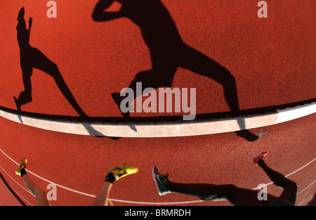 shadows of runners during 800m race during outdoor track and field ...