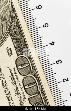 White ruler and dollar close up shot Stock Photo - Alamy