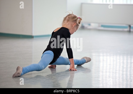 little pretty girl doing splits outdoors Stock Photo - Alamy