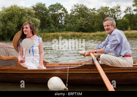 Family rowing a boat on the River Thames at Richmond upon Thames Surrey ...