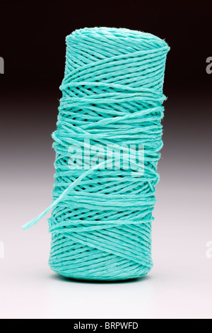 Ball of twine unraveling Stock Photo - Alamy
