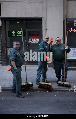 Sanitation workers cleaning up after a ticker tape parade in New York ...