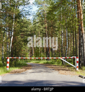 Barrier, blocking the road into the woods Stock Photo - Alamy