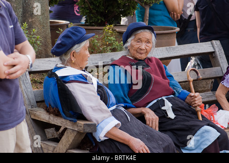 Chinese women of Dai ethnic minority pour water on the ground to ...