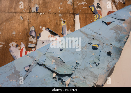 Peeling billboard poster sheets near 2012 Olympic Park construction ...