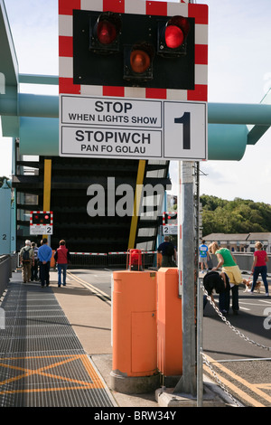 Road sign on the Cardiff Bay barrage warning of a lifting road bridge ...