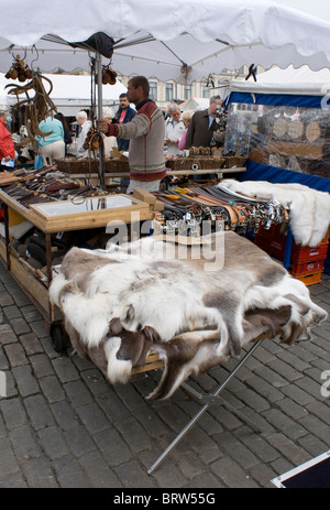 A fur stall in the Kauppatori quayside market in Helsinki. A rack of ...