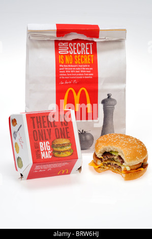 McDonald's bag with a Big Mac that has a bite taken out of it & take ...