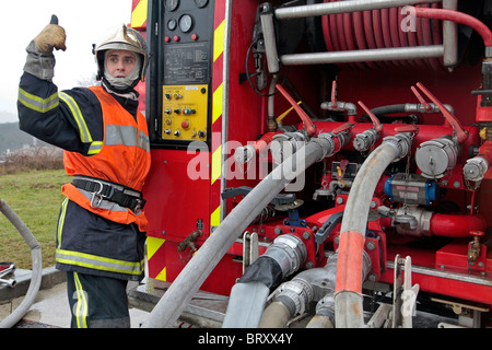 Fire department tanker truck filling a drop tank Stock Photo - Alamy