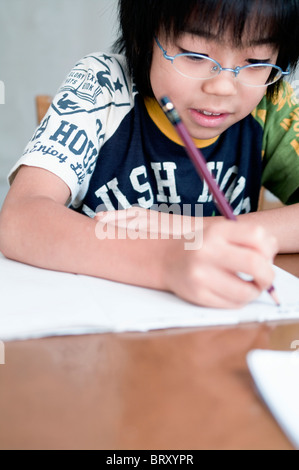 Boy doing homework, Japan Stock Photo - Alamy
