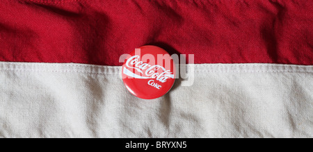 A Coca-Cola badge pinned to an American flag Stock Photo - Alamy