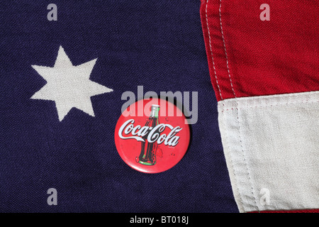 A Coca-Cola badge pinned to an American flag Stock Photo - Alamy