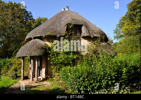 traditional small thatched cottage at the entrance to gaunts house near ...