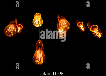 Light from a light bulb dangling above Stock Photo - Alamy
