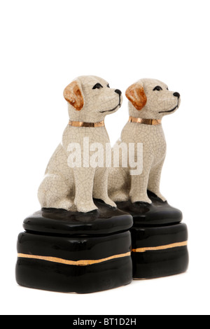 Porcelain dog figurines on a white background Stock Photo - Alamy