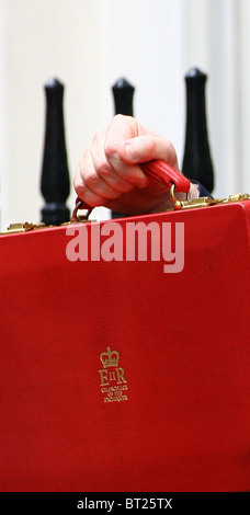 Chancellor of the Exchequer Gordon Brown holds the red dispatch box ...