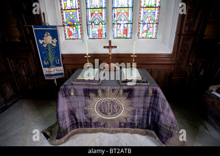 The front and altar area of a Gothic styled Anglican Church in England ...