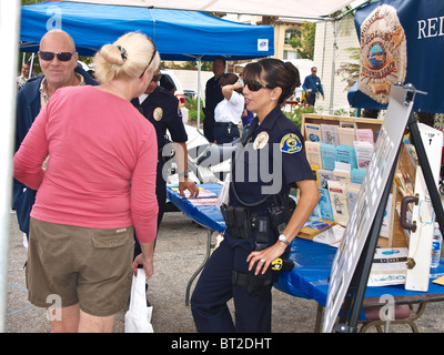 Female Police and Community Safety Officer or PCSO on duty directing ...