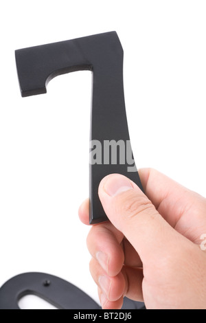 Hand holding number seven on a white background Stock Photo - Alamy