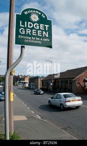 Sign which says 'Lidget Green striving to be a safe community ...