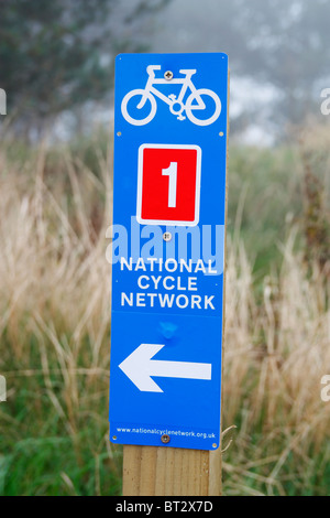 national cycle network track sign and dark figure in the snow Stock ...