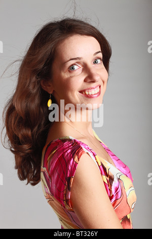 The woman in a motley dress Stock Photo - Alamy