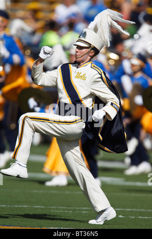 Member of the UCLA Bruins marching band performs before a football game ...