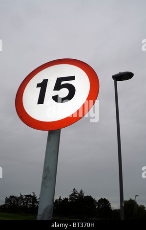 A 15 mph speed limit traffic sign against an overcast grey sky Stock ...