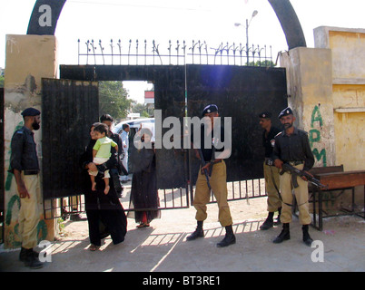 Police guard a polling station during the runoff presidential election ...