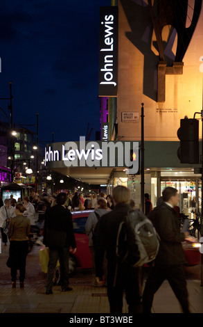 Late night crowd of people a front of information board at the airport ...