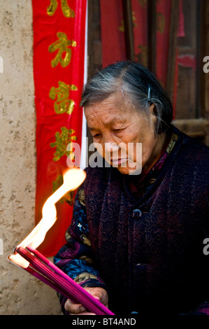 Lighting up the incense sticks in a Chinese temple in Saigon Stock ...