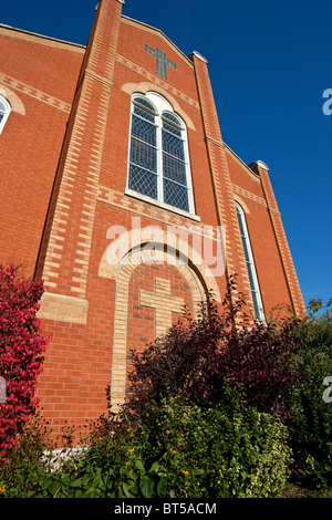 The front of a modern church, with orange brick, in Elora, Ontario ...