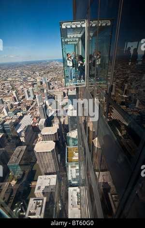 Tourists in glass balcony skydeck observation deck view Chicago ...