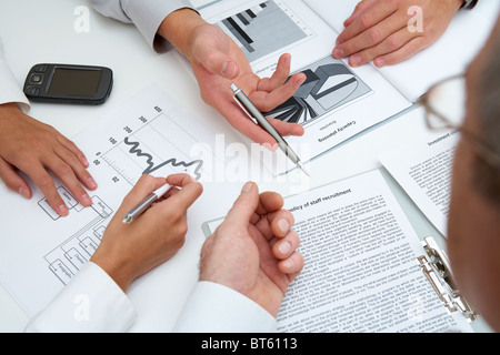 Image of human hands during paperwork at briefing Stock Photo - Alamy