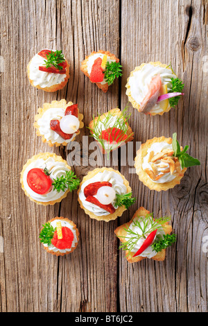 Variety of pastry-based canapes with various toppings Stock Photo - Alamy