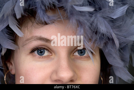 Portrait of the beautiful girl with a boa on a head Stock Photo - Alamy