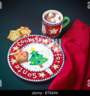 Close up a festive mug, and a plate of fresh pumpkin-shaped buns on ...