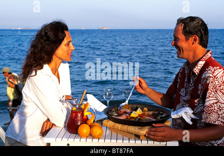 People eating Paella on Playa d'en Bossa, Ibiza, Balearic Islands ...