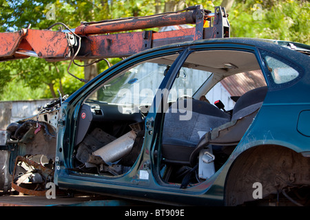 scrapped car placed on lorry for taking to scrap yard Stock Photo - Alamy