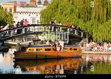 Canal boat passes under a bridge on the Trent and Mersey Canal near the ...